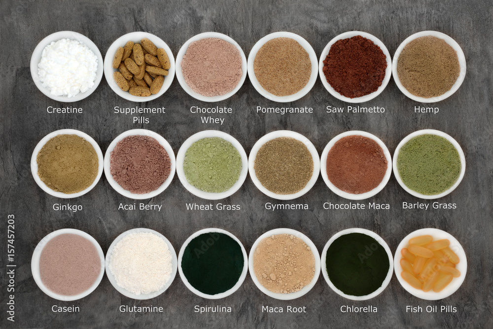 Body building health food supplement powders in porcelain bowls over ...
