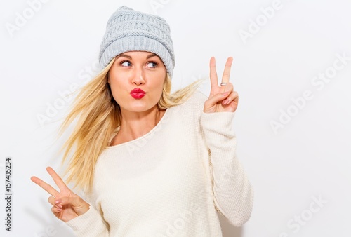 Young woman giving the peace sign Stock-Foto | Adobe Stock Young woman giving the peace sign Stock-Foto | Adobe Stock