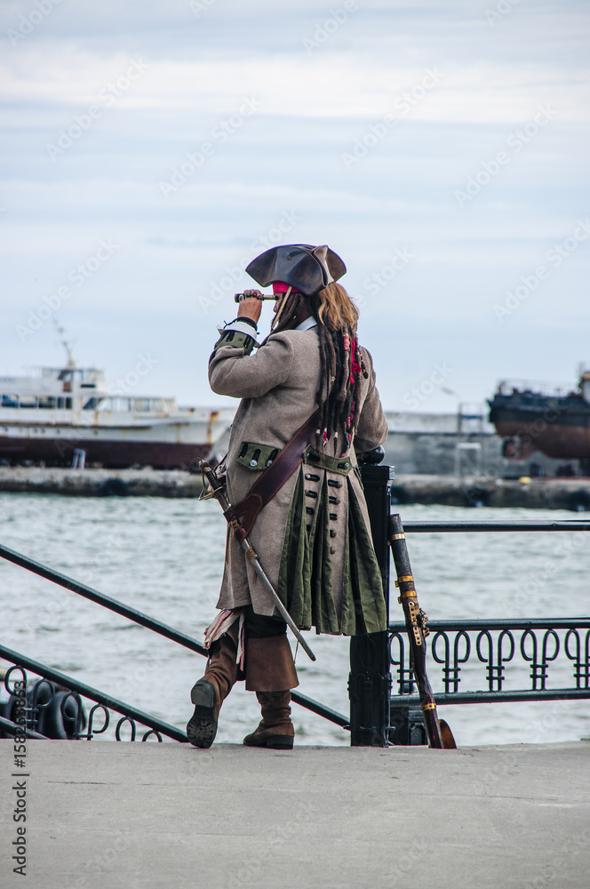 Captain of a pirate ship looks at the sea Stock Photo | Adobe Stock