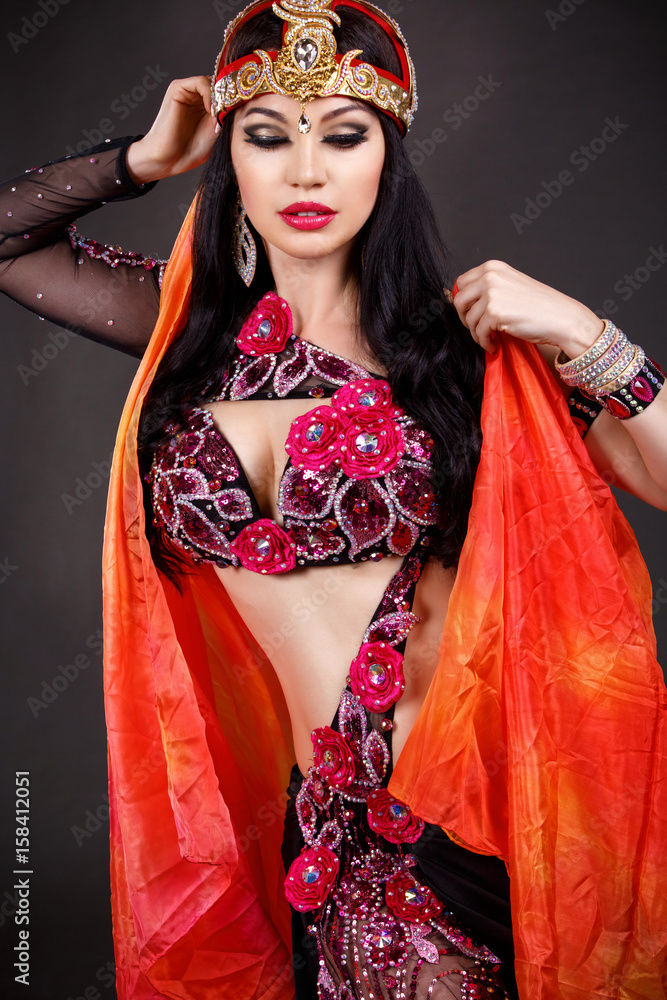 Beautiful arabian bellydancer woman in belly dance costume. Asian dancer girl bellydancing ...