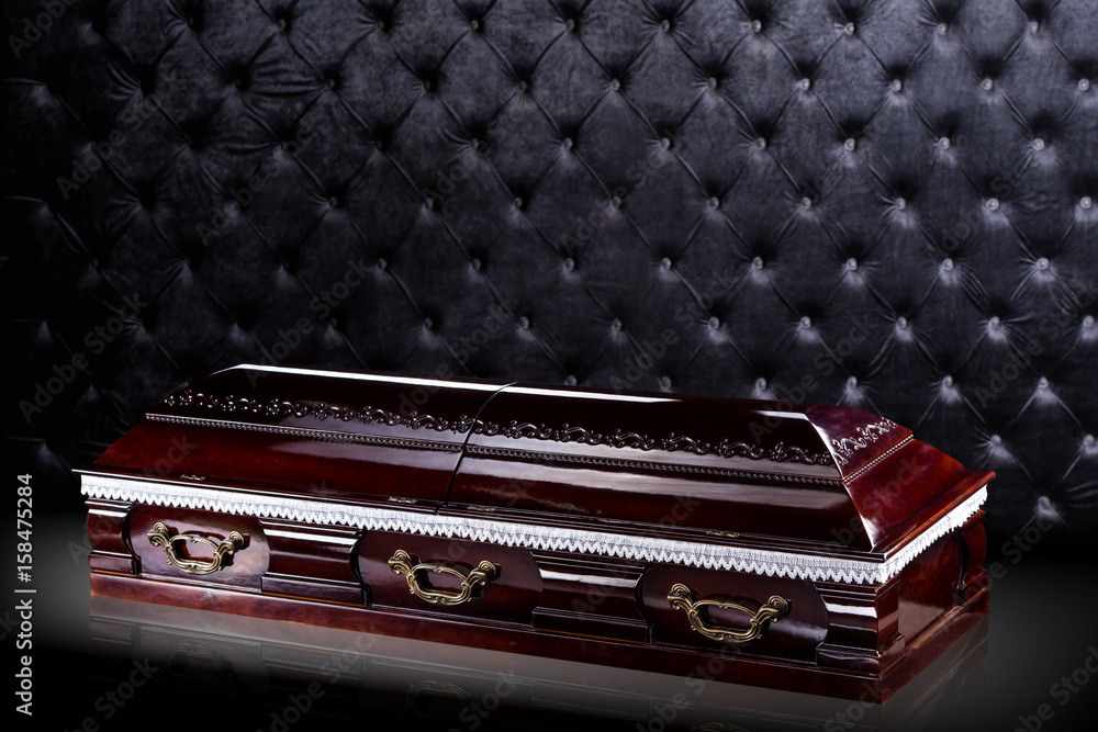 closed wooden dark brown coffin isolated on gray luxury background ...