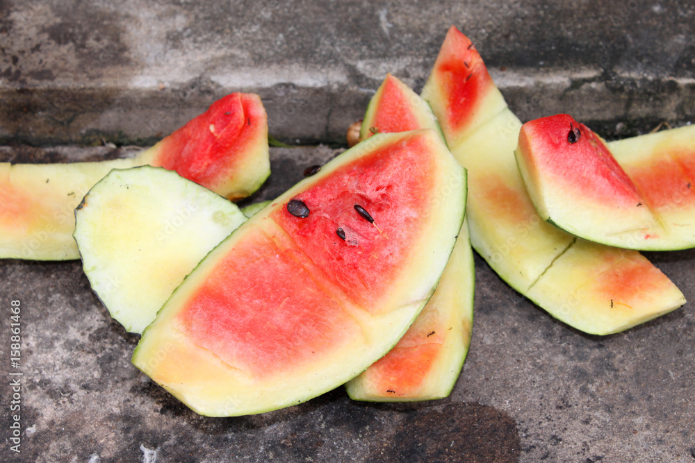 thrown away peeled water melon at footpath Stock Photo | Adobe Stock