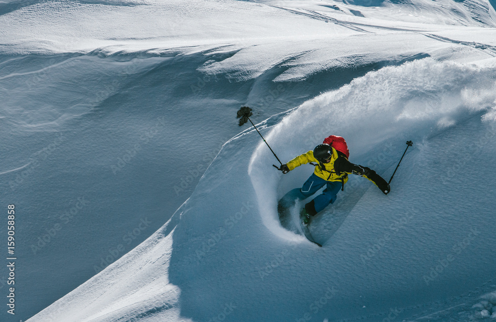 freerider doing a powder turn in fresh deep snow Stock Photo | Adobe Stock
