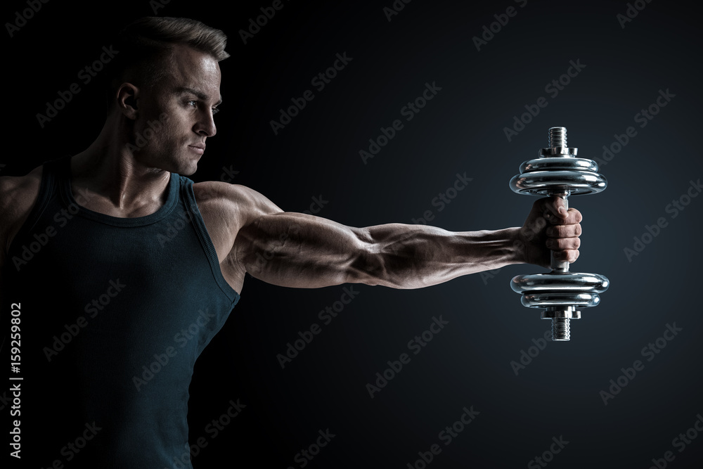 Stock-Foto „Male bodybuilder workout pumping up muscles holding ...