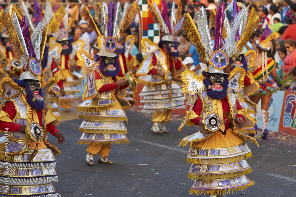 Morenada dance group in traditional Andean costume performing at the ...