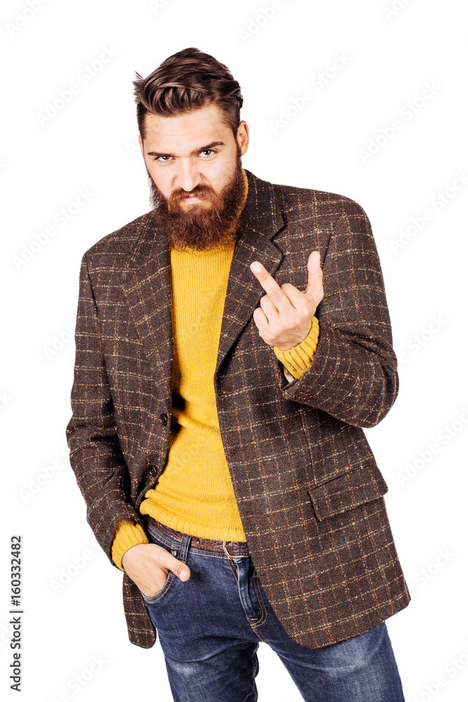 angry man looking at camera and showing middle finger. studio shot ...