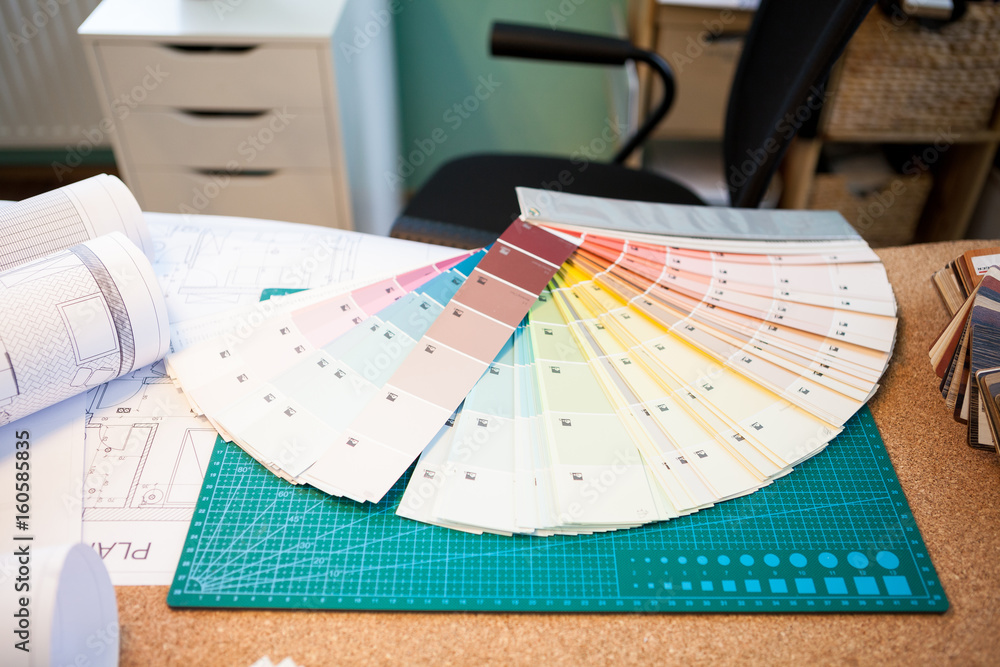 Architect with color palette on her desk. Working on new architect and ...