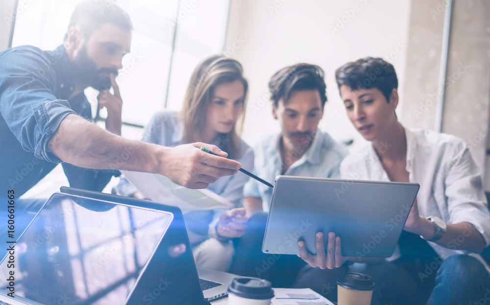 Teamwork process.Young coworkers work with new startup project in ...