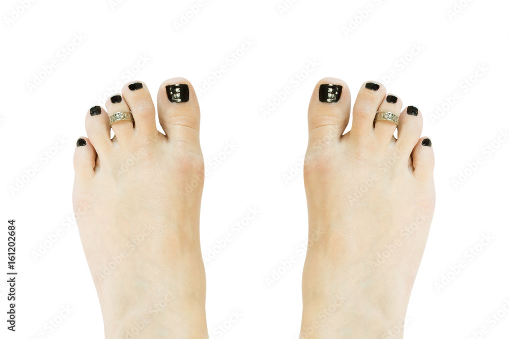 Barefoot woman with black painted toes and toe ring isolated on white ...