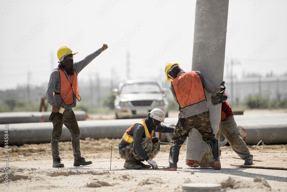 construction worker in construction site safety uniform install ...