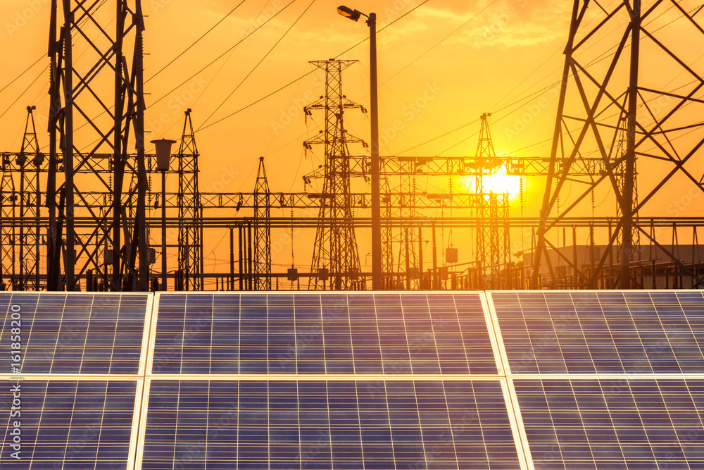 solar cells in power station with high voltage electric pillars ...