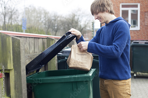 Guy throwing out trash - Buy this stock photo and explore similar ...