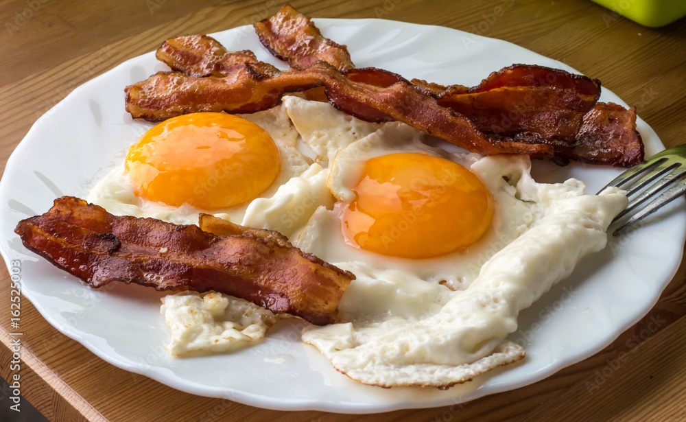 Bacon and eggs. Breakfast. Country style fried eggs with pork ham Stock ...