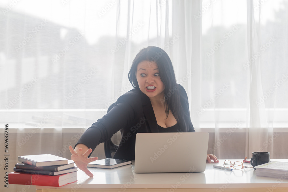 Angry business woman.Young frustrated business woman in the office Stock Photo | Adobe Stock