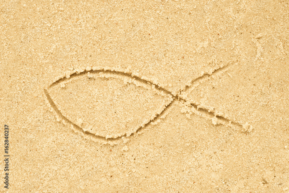 Jesus fish symbol drawing in sand Stock Photo | Adobe Stock