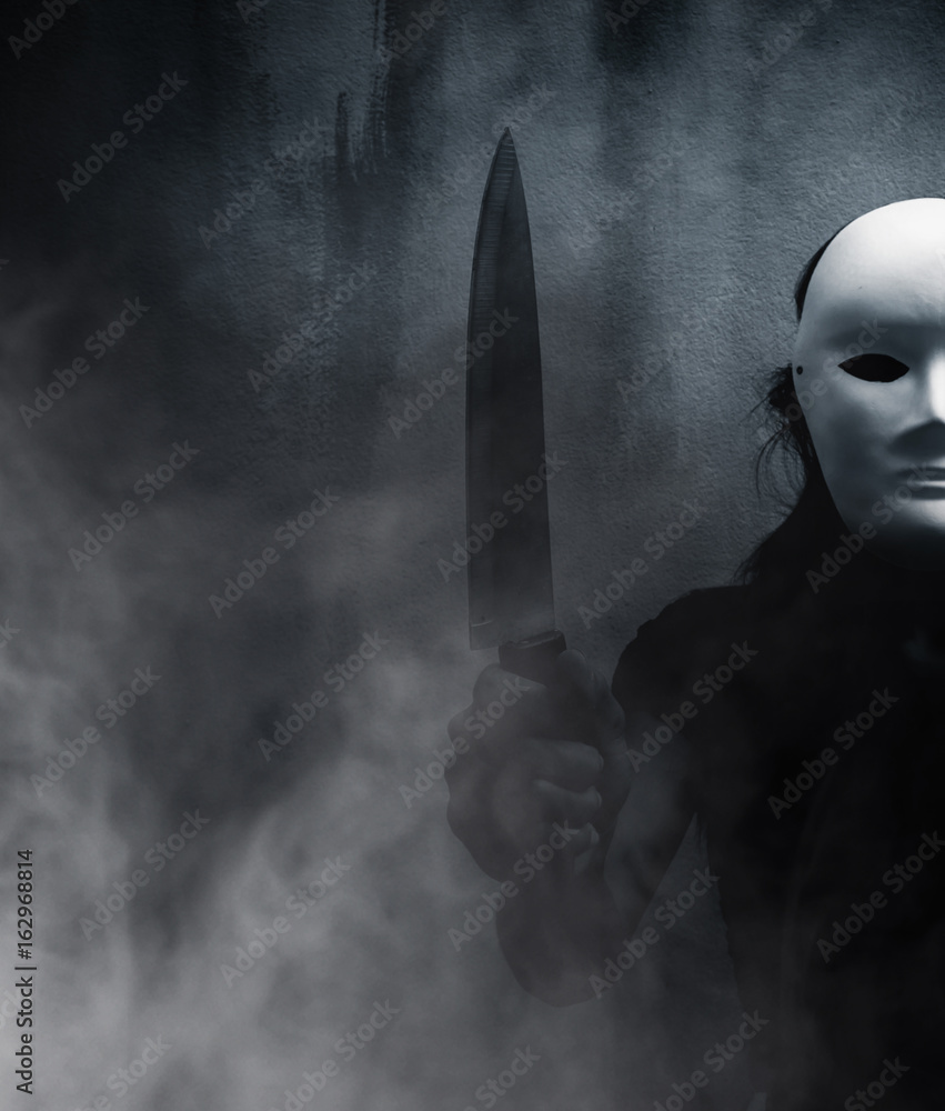 Mysterious woman in black wearing white mask with knife,Scary ...