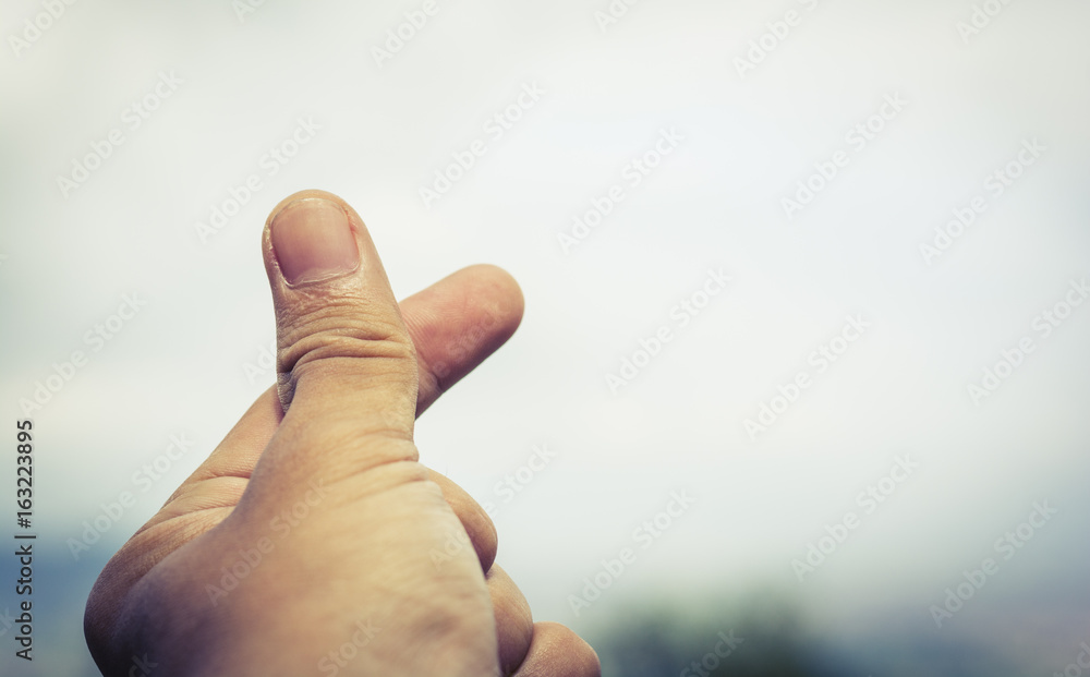 Fotografie abstract background of hand making symbol of mini heart the ...