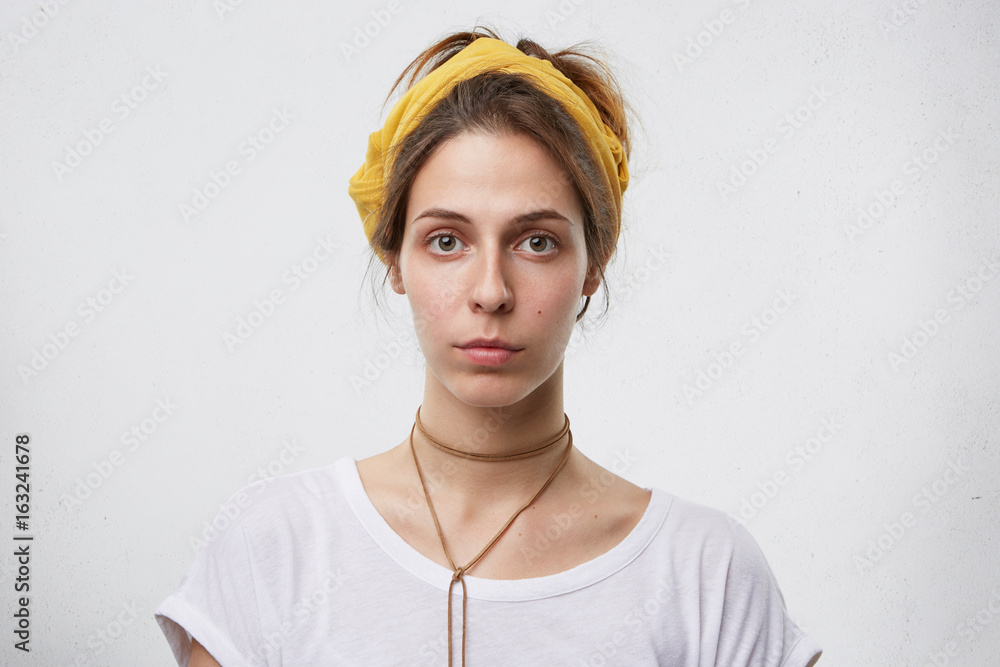 Attractive female with dark eyes, thin lips and healthy pure skin ...