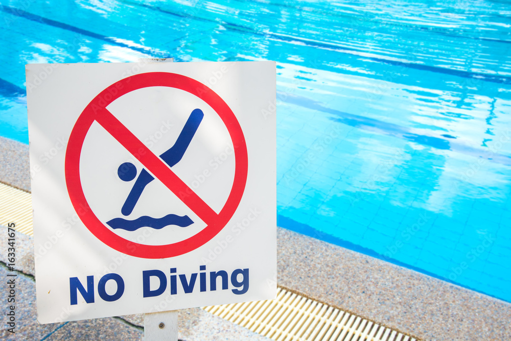 warning sign for safety at swimming pool. Stock Photo | Adobe Stock