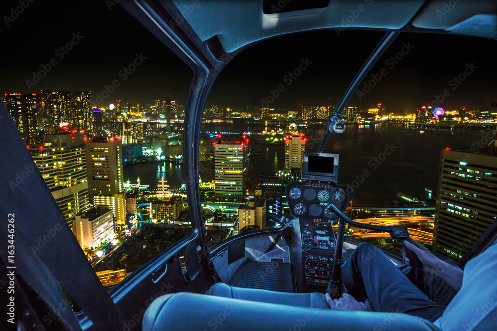 Helicopter flying over Tokyo cityscape, the Bay area with its bridges ...