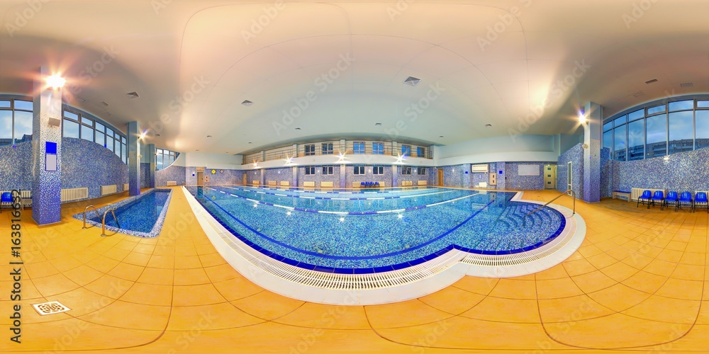 Big indoor swimming pool with blue water at fitness centre with yellow ...
