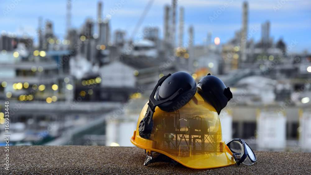 Safety in Refinery Concept , safety standard set on working table ...