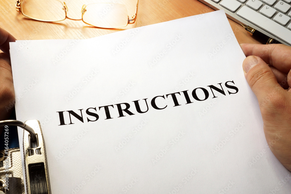 Instructions in a blue folder. Guidebook concept. Stock Photo | Adobe Stock