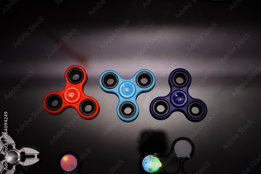 Hand spinners or fidgeting spinners. Many types and shapes of spinners ...