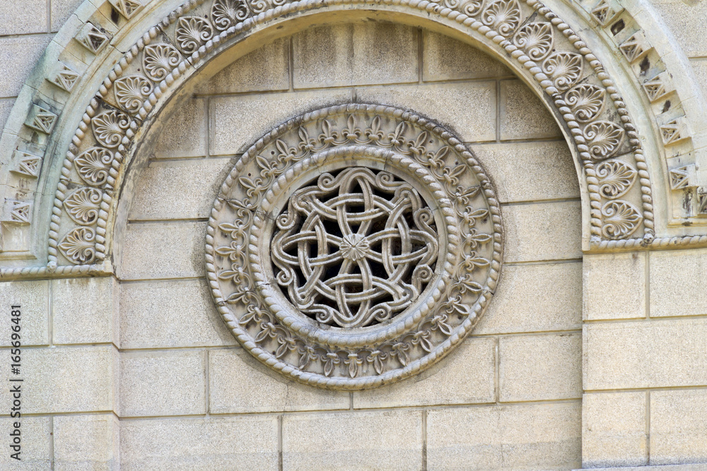 Stone rosette - window made of decorated stone, ornaments and relief on ...