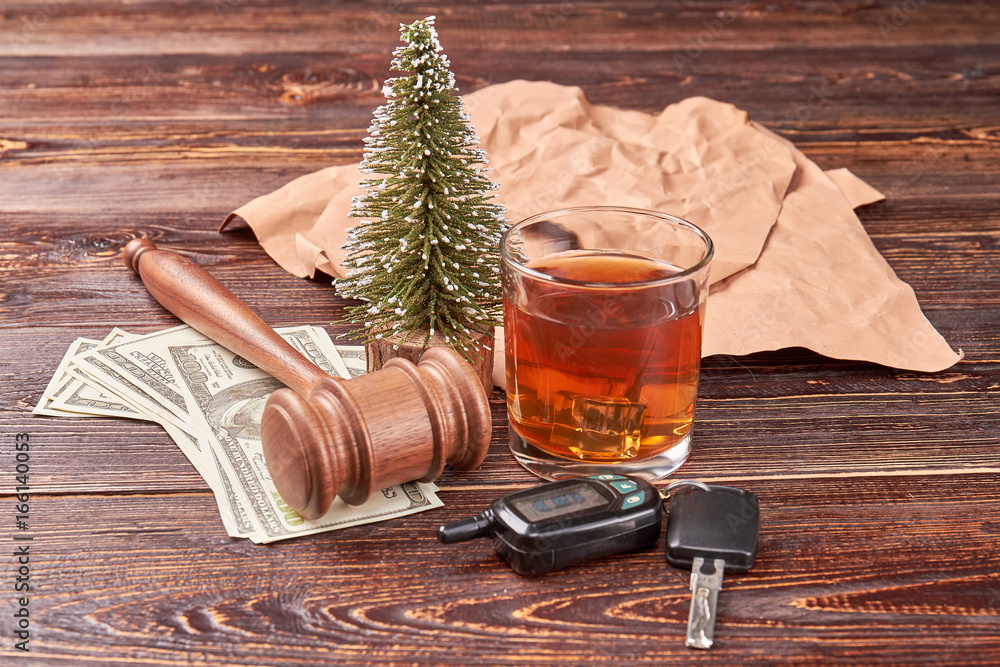 Gavel on dollars, key, alcohol. Glass of whiskey beside car keys and ...