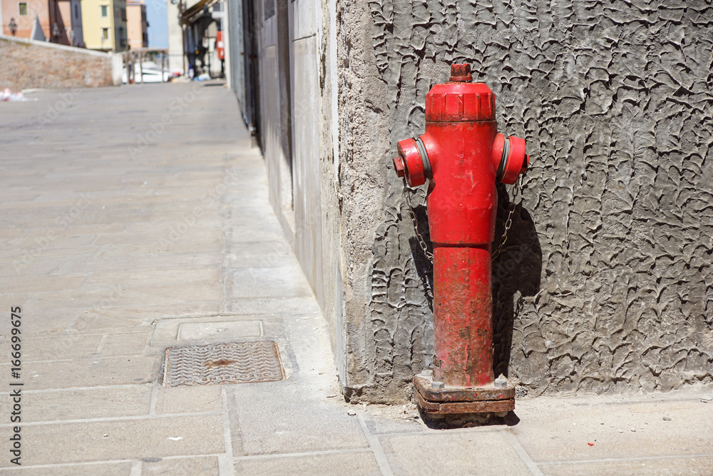 Old red fire hydrant in the street. Fire hidrant for emergency fire ...