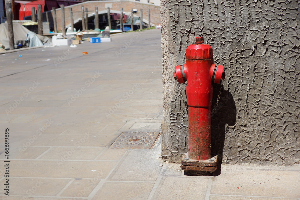 Old red fire hydrant in the street. Fire hidrant for emergency fire ...