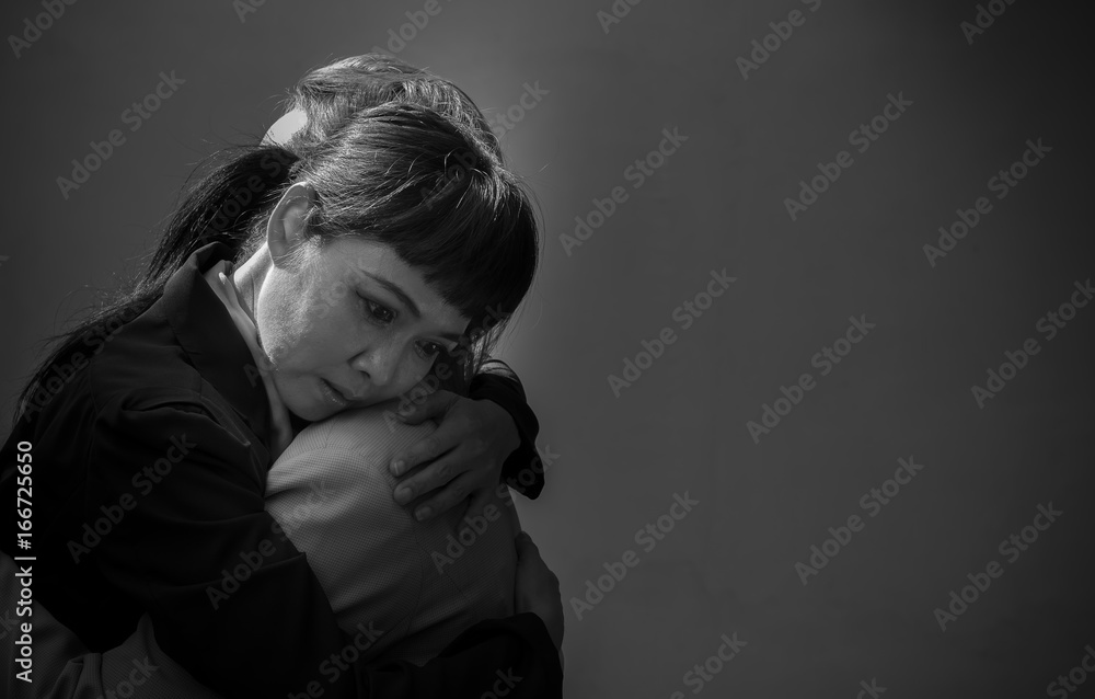 Women are embracing with sad emotions. Stock Photo | Adobe Stock