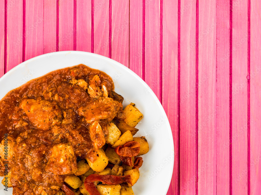 Spanish Style Bravas Chicken Tapas With Roast Potatoes Stock Photo ...