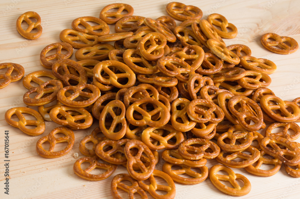 Background texture of salted savory mini pretzels in the traditional ...