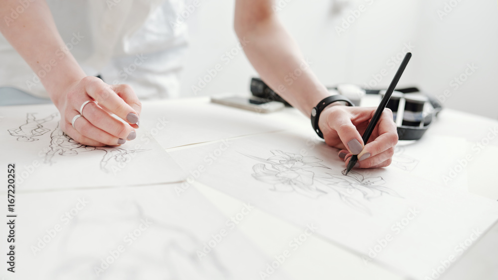 Female illustrator drawing sketches Stock Photo | Adobe Stock