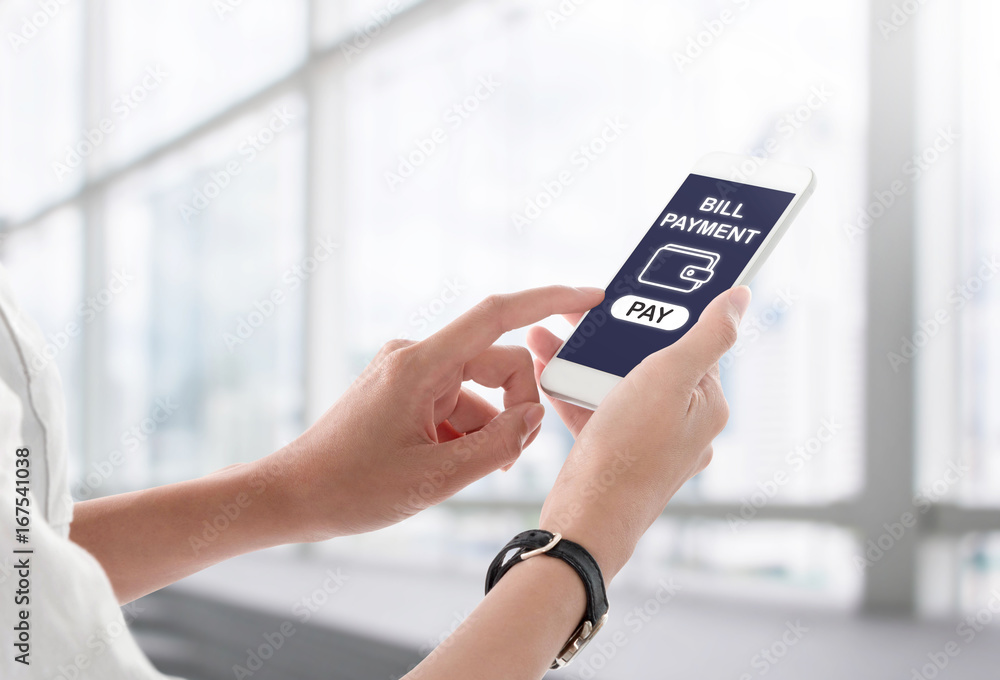 Woman hands holding and using smartphone with bill payment screen ...