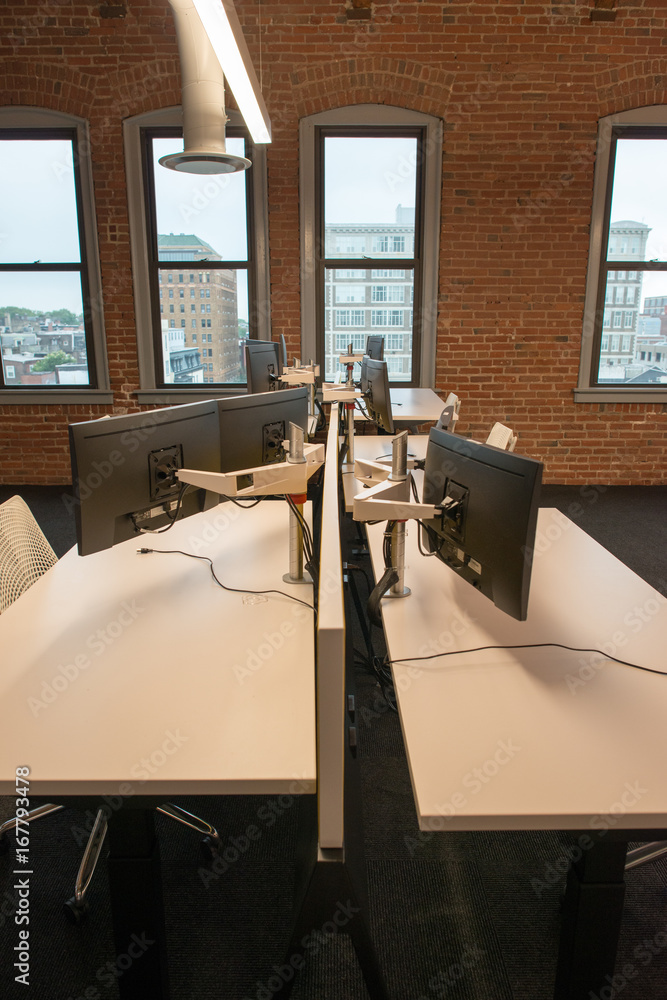 Trendy modern open concept loft office space with big windows, natural light and a layout to ...