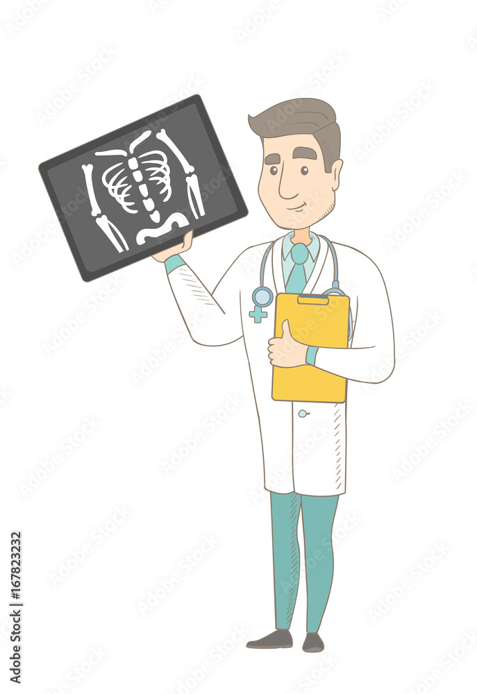 Caucasian doctor examining radiograph. Young doctor in medical gown ...