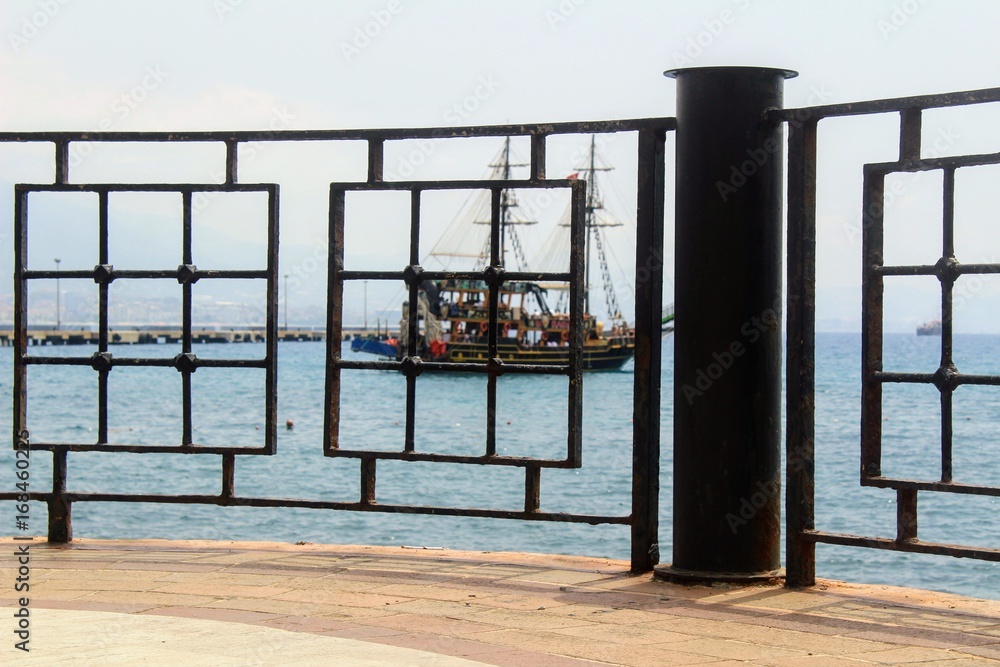 Wrought-iron grille waterfront observation deck in the harbour (Antalya ...
