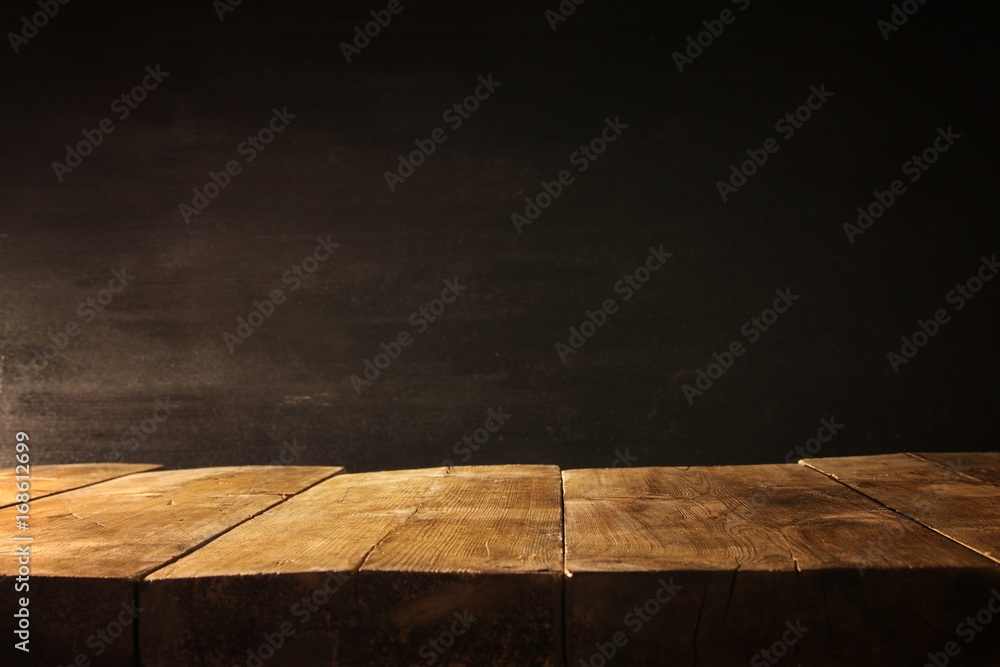 wooden table and blackboard background. Ready for product display ...
