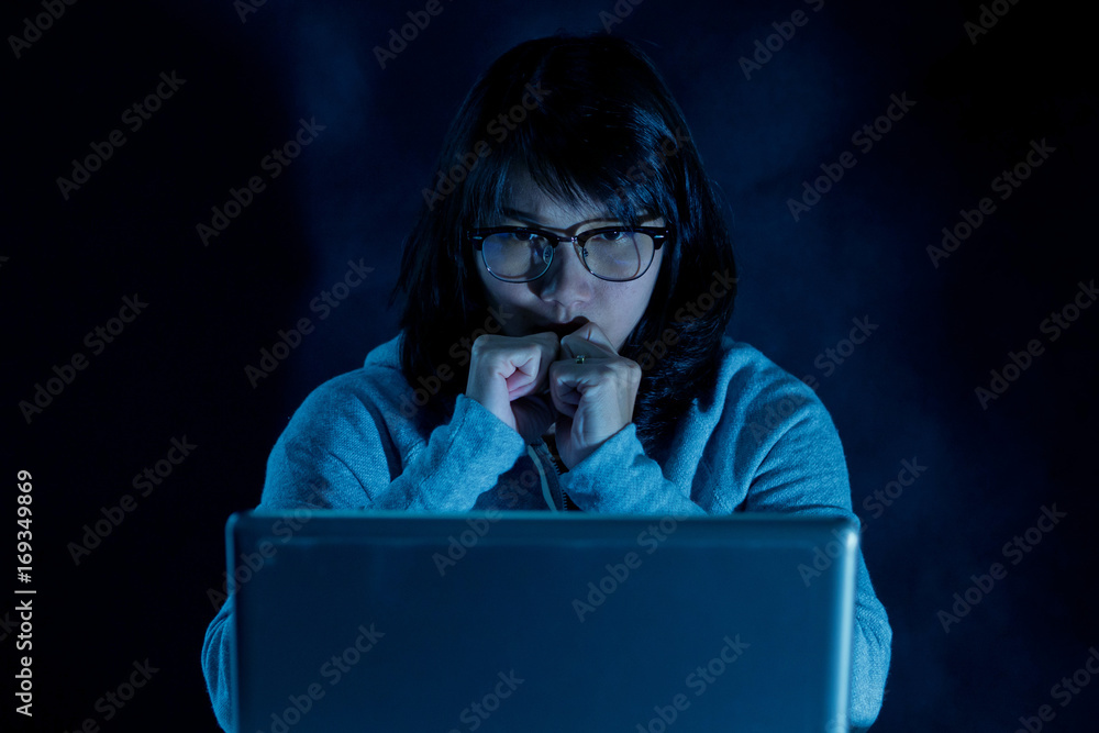 Photo Stock hacker in front computer with laptop / stealing information ...