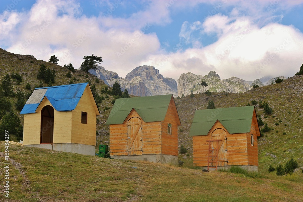 Some wooden huts for an overnight stay on the top of a mountain pass ...