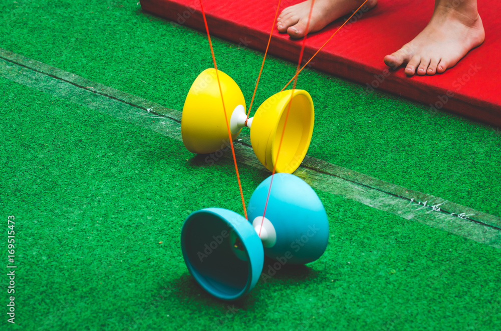 Child playing with Diabolo toy Stock Photo | Adobe Stock