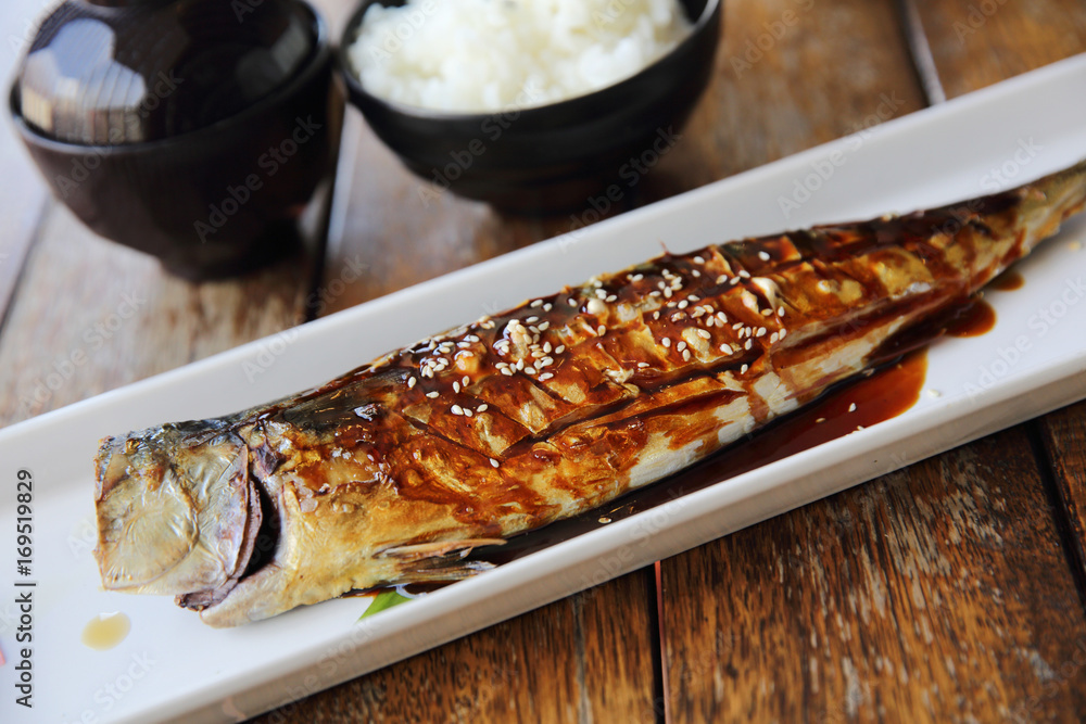 Grilled Mackerel fish with sauce , Saba yakitori on wood background ...