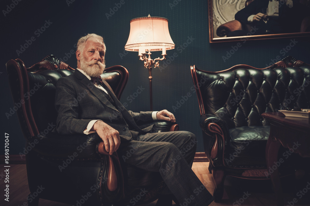 Well-dressed senior man in luxury interior Stock Photo | Adobe Stock