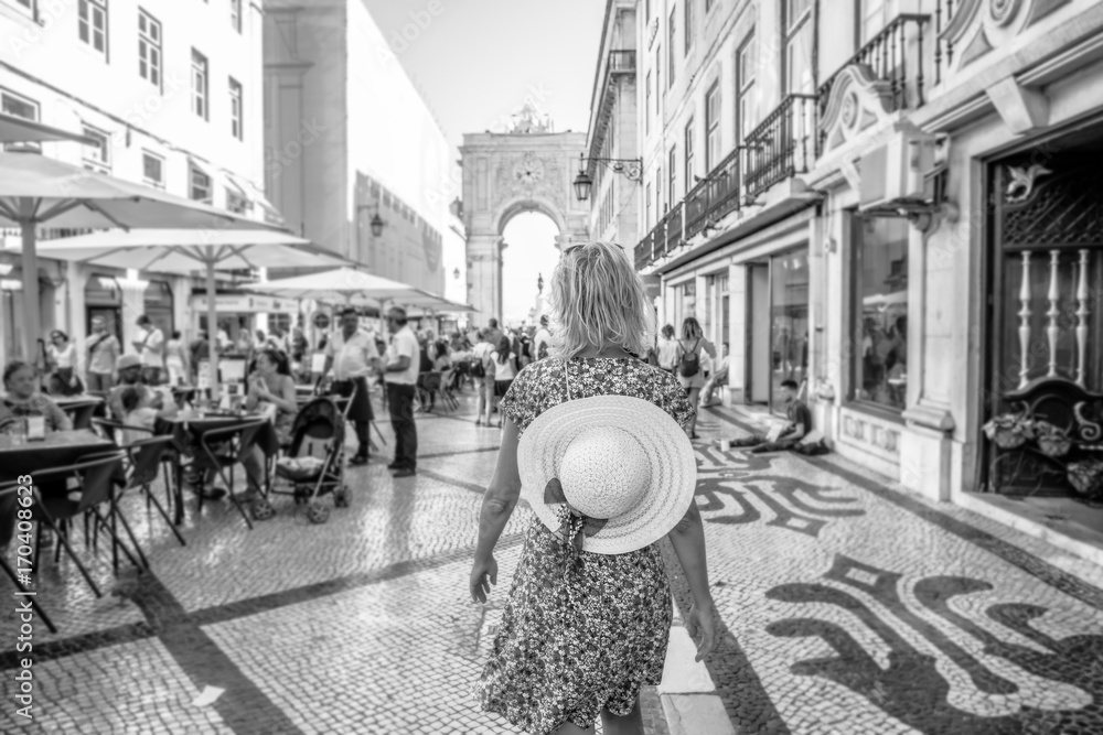 Tourism in Europe. Woman walking on popular Rua Augusta between cafes ...