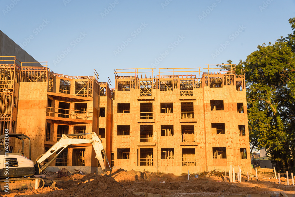 Site construction of unfinished wood framing multi-storey apartment ...