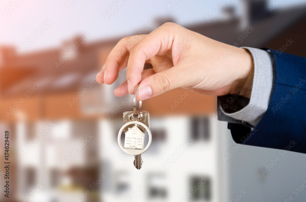 Real estate agent with home keys Stock Photo | Adobe Stock