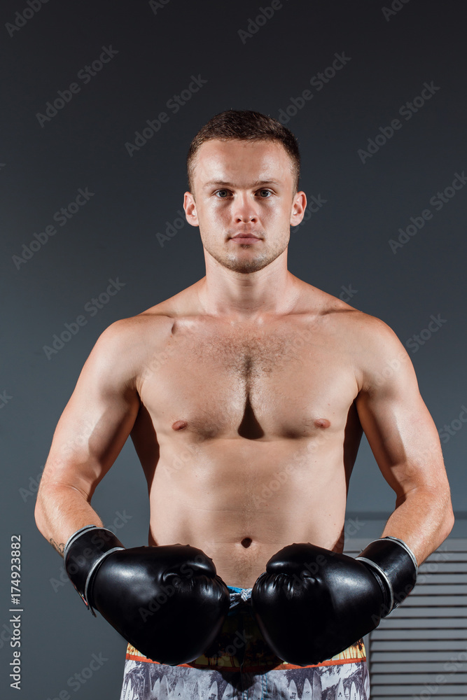 handsome man or healthy boxer or Thai boxer with six pack wearing ...